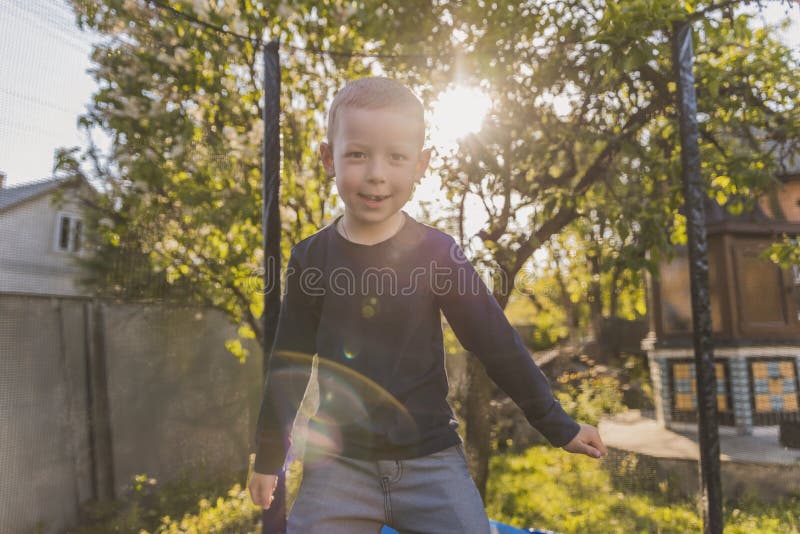 Boy Jumping on a Trampoline Stock Image - Image of bungee, jumping ...