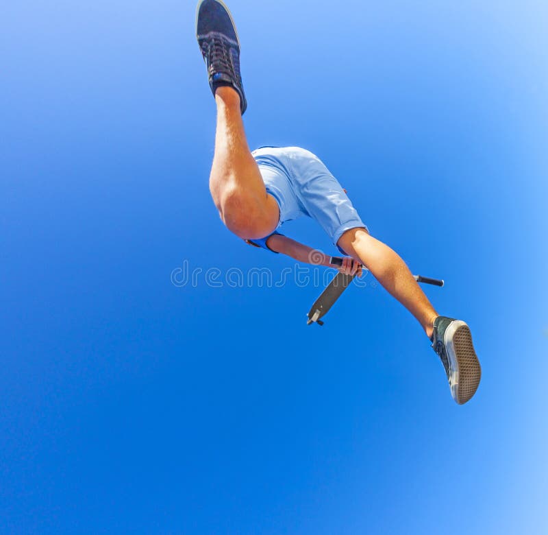 Boy Jumps at the Skatepark with His Scooter Stock Photo - Image of ...
