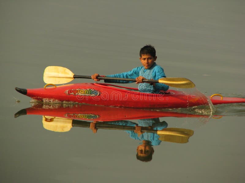 A boy and the kayak editorial image. Image of mountain - 70548860