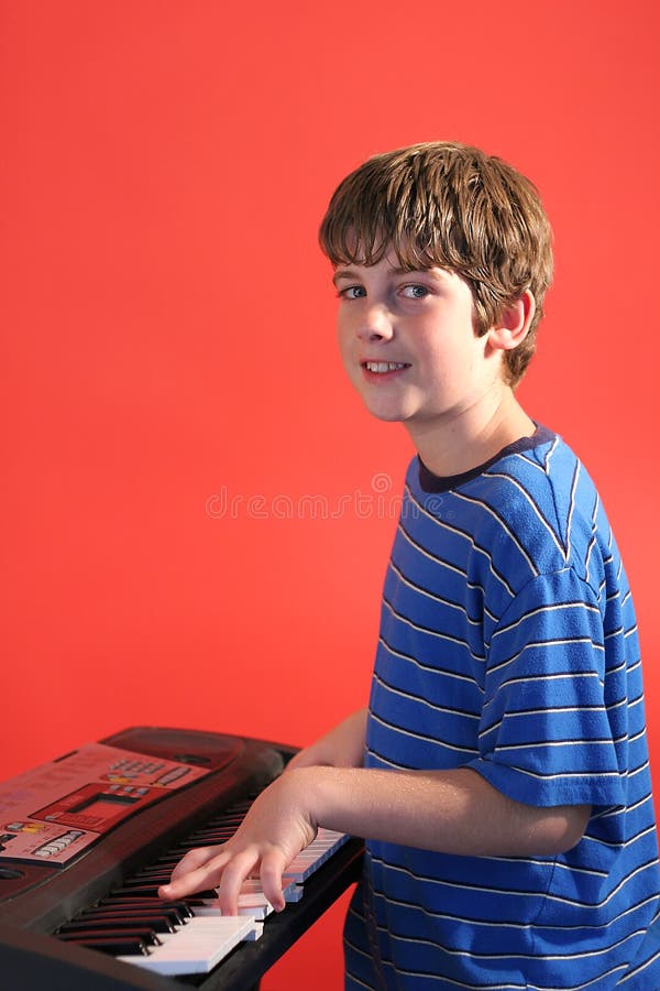 Boy on Keyboard Right Vertical Stock Image - Image of preteen, teen ...