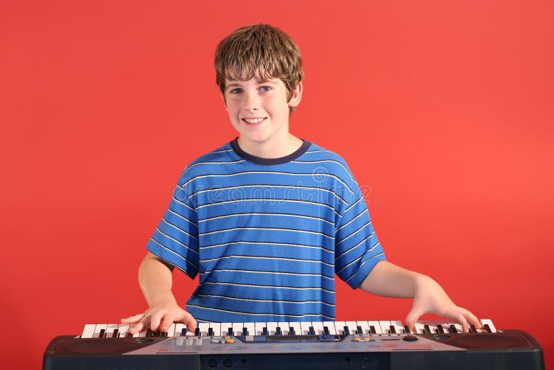 Boy on keyboard straight stock image. Image of teen, music - 2180521