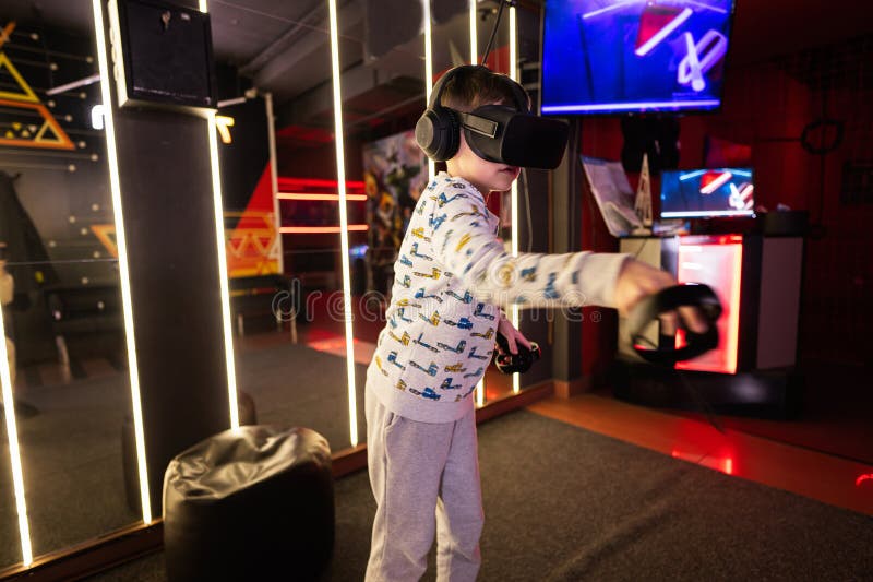 Boy Kid Playing Game Using Virtual Reality Headset and Gamepads in ...