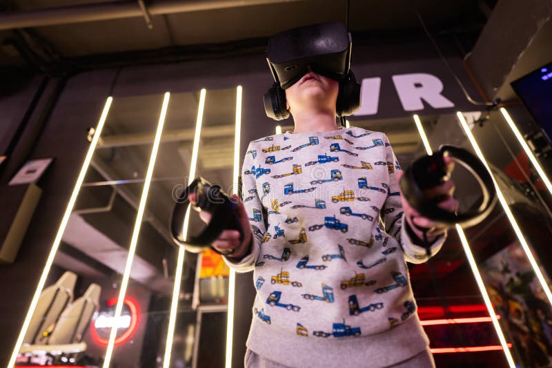Boy Kid Playing Game Using Virtual Reality Headset and Gamepads in ...
