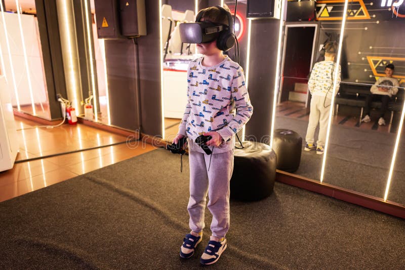Boy Kid Playing Game Using Virtual Reality Headset and Gamepads in ...