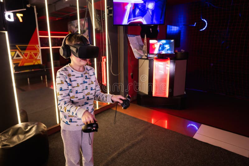 Boy Kid Playing Game Using Virtual Reality Headset and Gamepads in ...