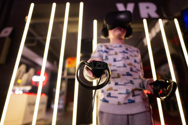 Boy Kid Playing Game Using Virtual Reality Headset and Gamepads in ...