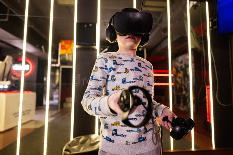 Boy Kid Playing Game Using Virtual Reality Headset and Gamepads in ...