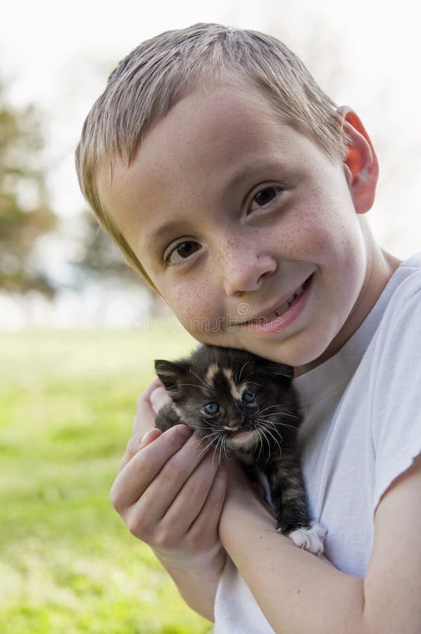 Boy and kitten portrait stock photo. Image of looking - 40345048