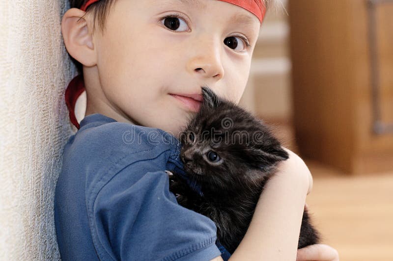 Boy with kitten stock image. Image of caucasian, dark - 69866155