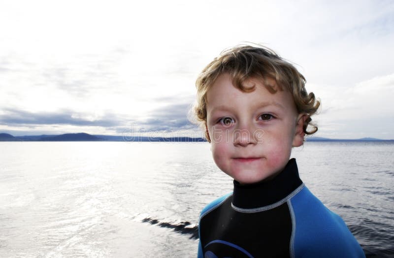 Boy at Lake stock photo. Image of aotearoa, wetsuit, male - 901422