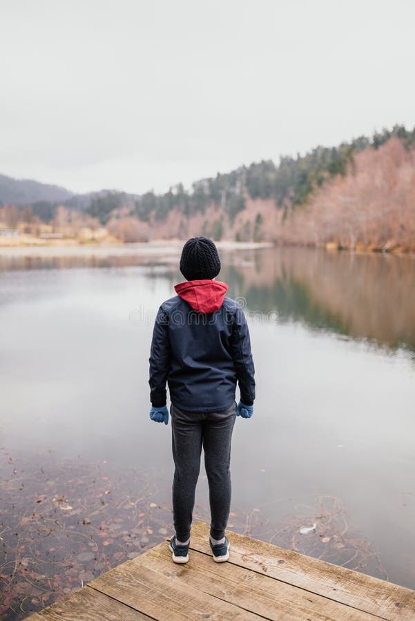 Boy by the lake stock image. Image of young, cold, autistic - 201925443