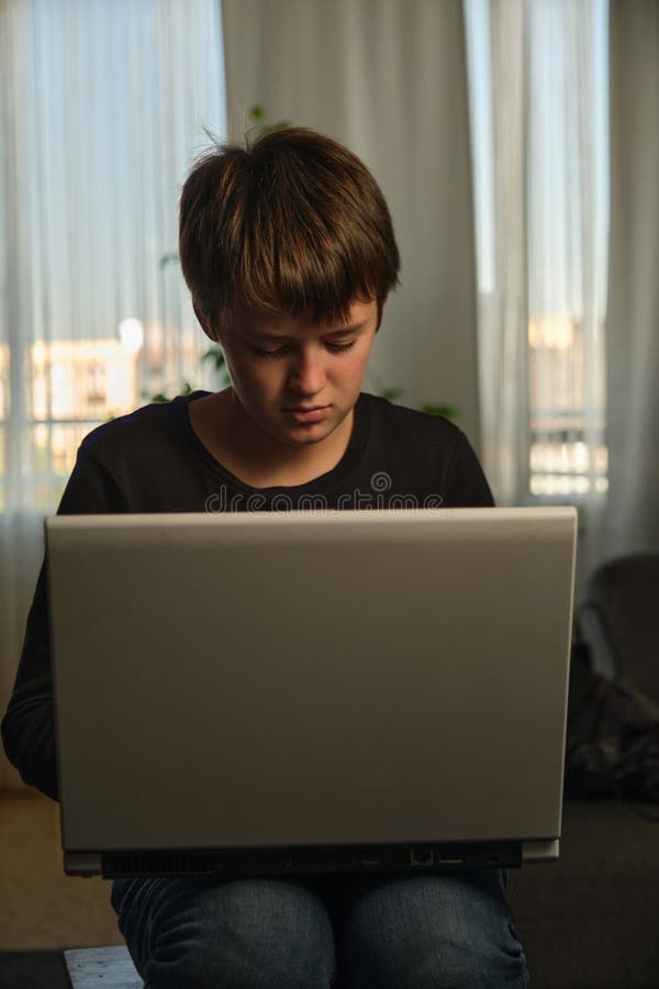A Boy with a Laptop Computer Stock Image - Image of portrait, studio ...