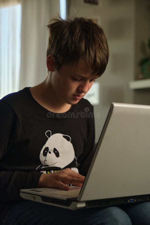 A Boy with a Laptop Computer Stock Photo - Image of student, browsing ...