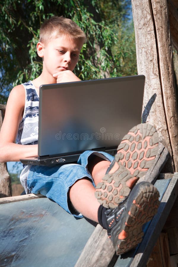 Boy with laptop stock image. Image of child, sunny, computer - 28000171