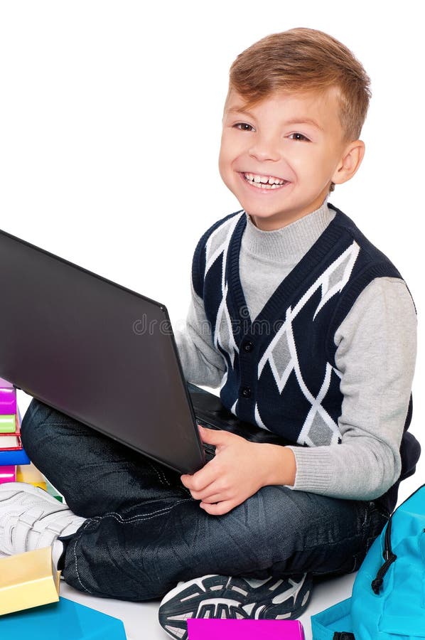 Boy with laptop and books stock photo. Image of childhood - 92907496