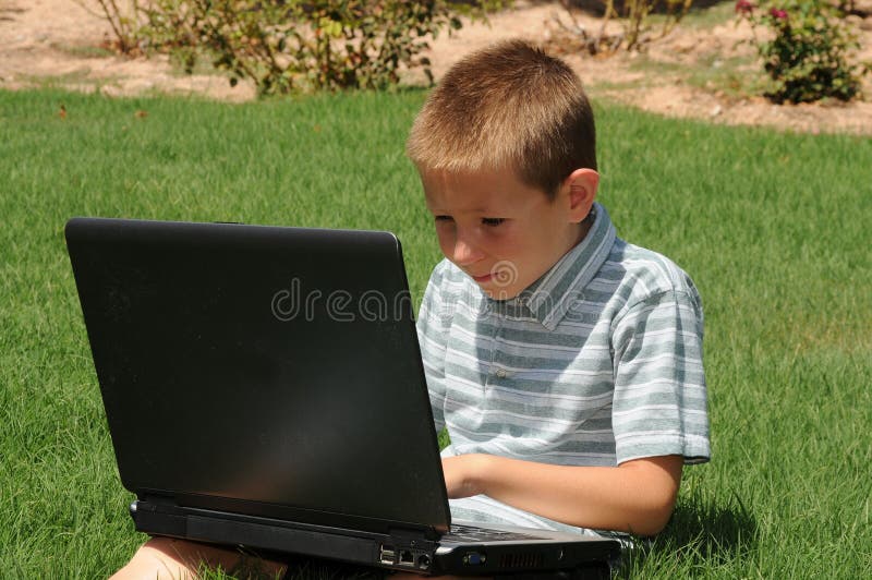 Boy with Laptop Computer stock image. Image of education - 6313775