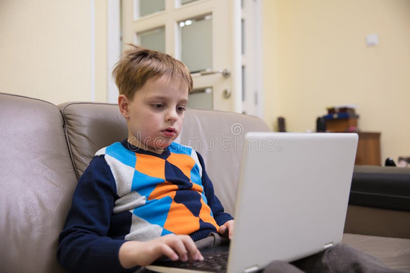 Boy with Laptop on Couch at Home Stock Image - Image of expression ...