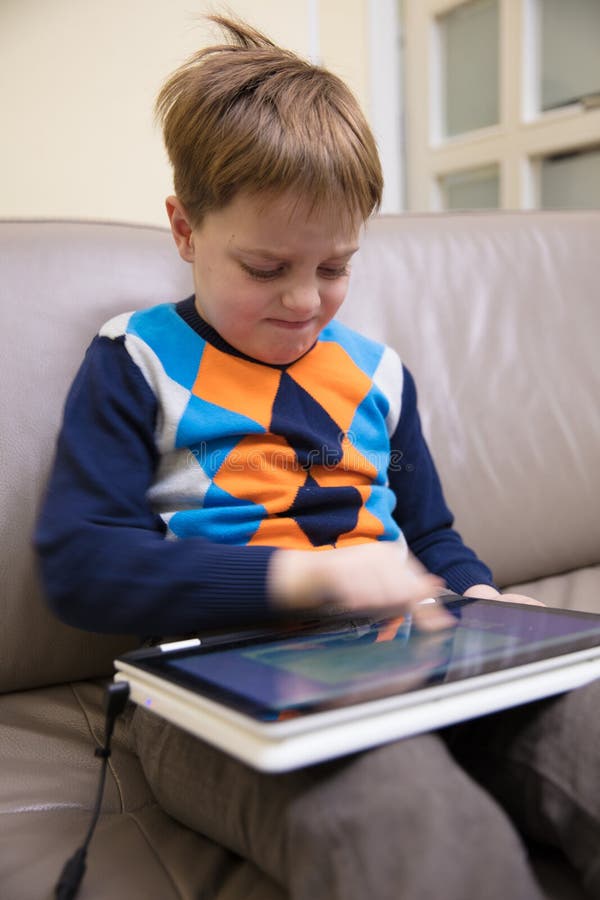 Boy with Laptop on Couch at Home Stock Photo - Image of electronics ...