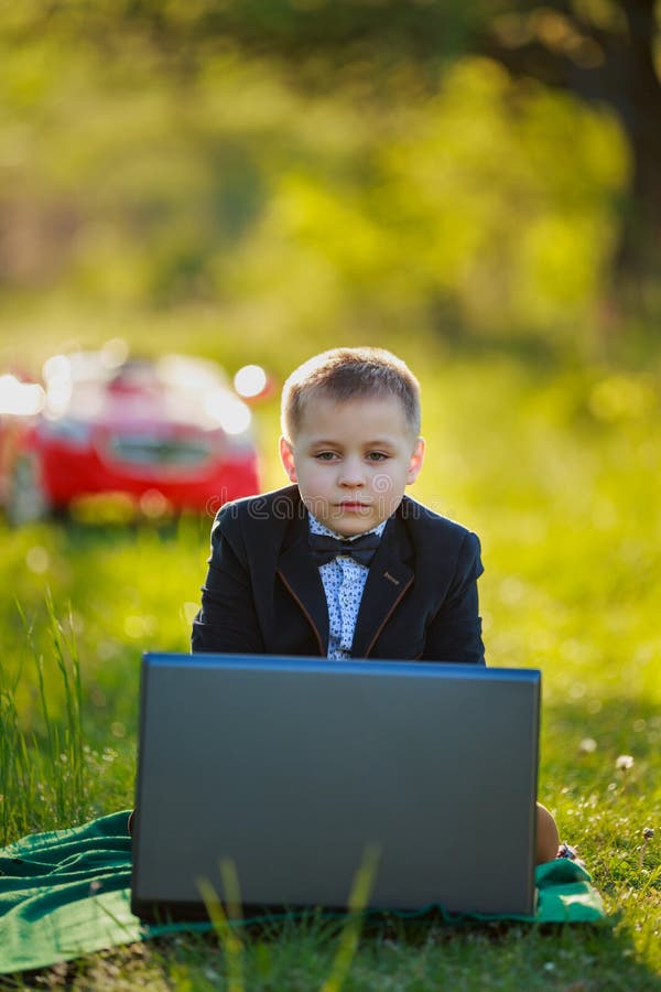 Boy with a laptop stock photo. Image of male, notebook - 76518222