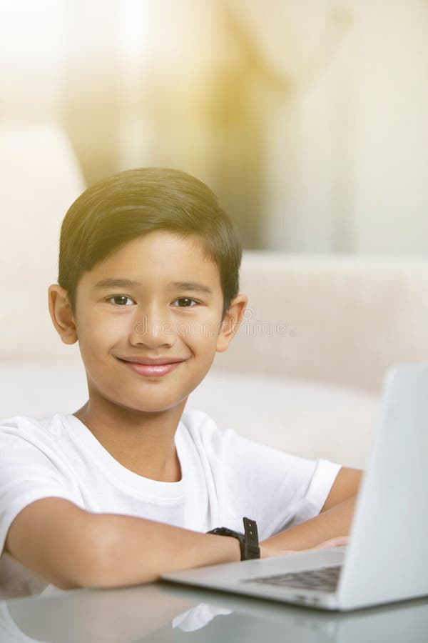 Boy with laptop smiling stock image. Image of smile - 183303767