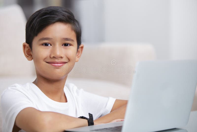 Boy with laptop smiling stock photo. Image of smile - 183303902