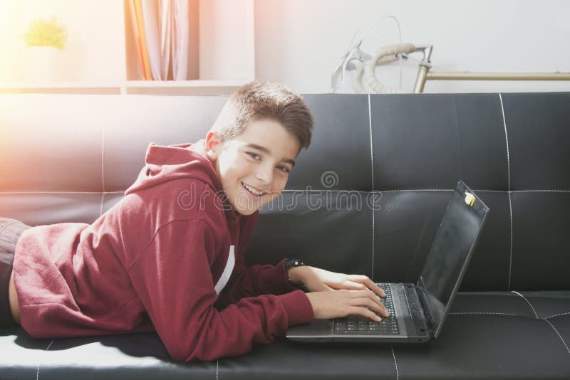 Boy with the laptop stock photo. Image of smiling, laptop - 81745230