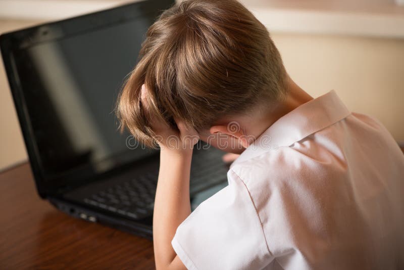 Boy with laptop at table stock photo. Image of concepts - 61277902