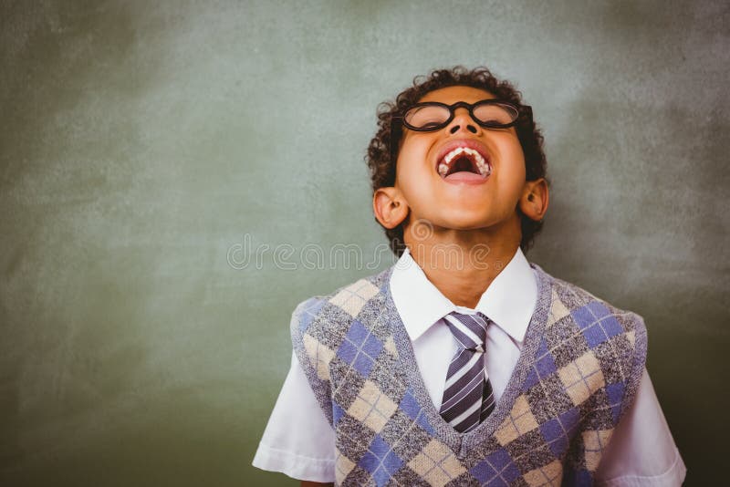 Boy Laughing in Front of Blackboard Stock Image - Image of cheerful ...