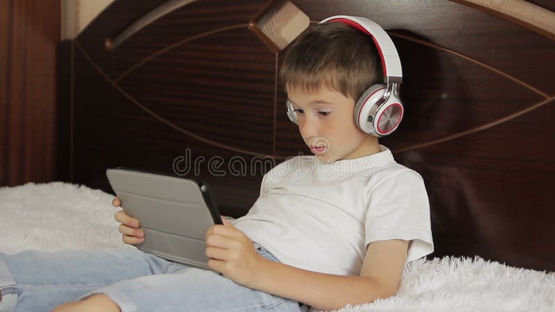 The Boy Lay Listening To Music or Have an E-learning Class Using His ...