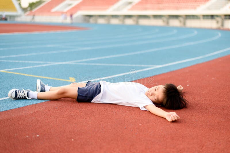 Boy Lay on the Running Track Stock Photo - Image of blue, sleep: 68177724