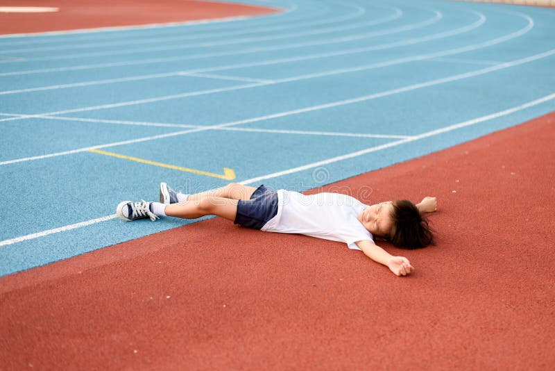Boy Lay on the Running Track Stock Image - Image of runner, summer ...