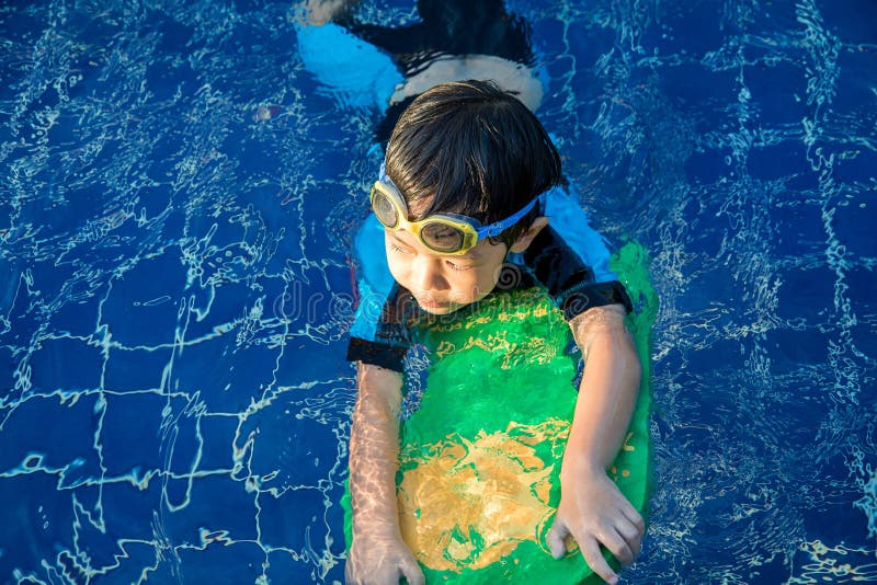 Boy Learn To Swim in the Swimming Pool Stock Image - Image of sport ...