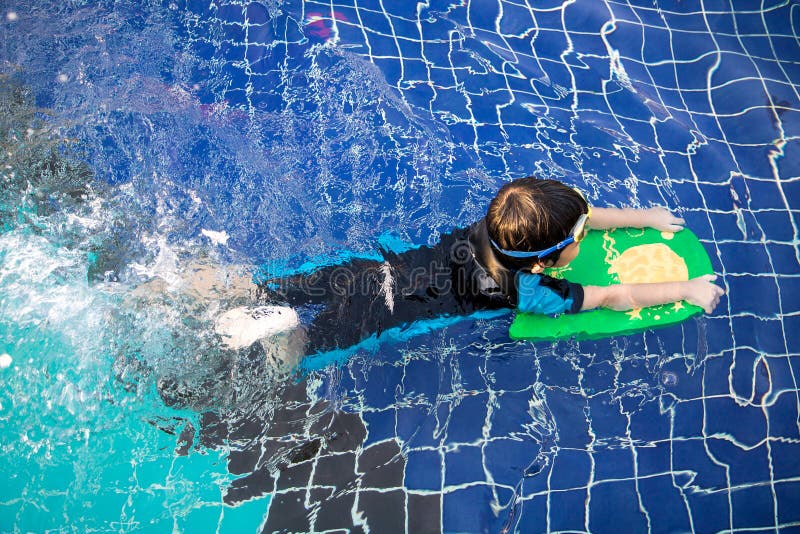 Boy Learn To Swim in the Swimming Pool Stock Photo - Image of summer ...