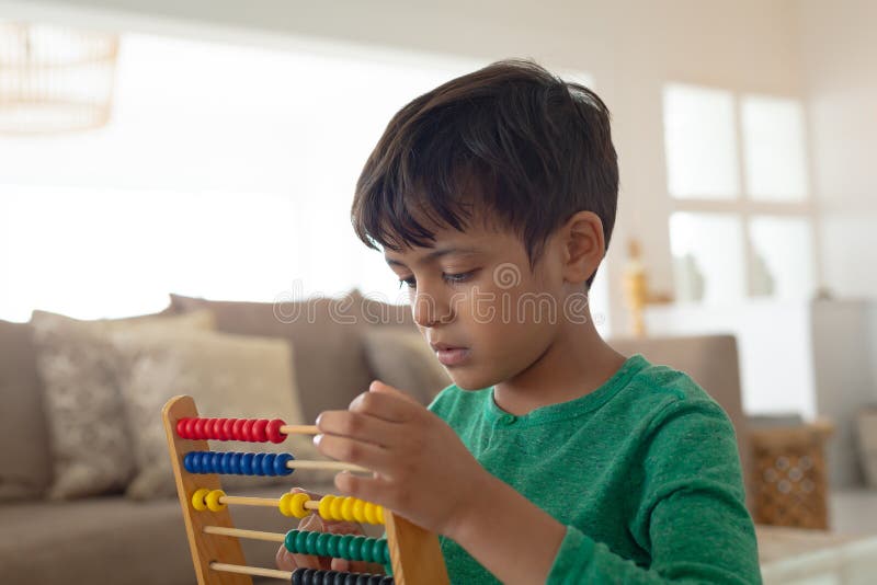 Boy Learning Mathematics with Abacus in a Comfortable Home Stock Image ...