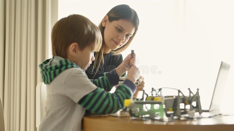 Boy Learning Online in Coding Robot Car and Electronic Board in STEM ...