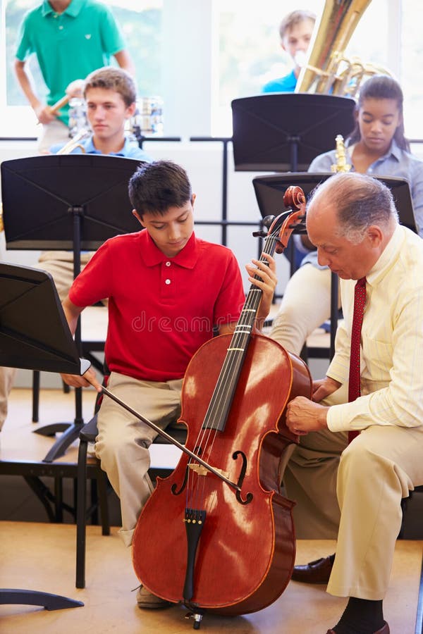 Boy Learning To Play Cello in High School Orchestra Stock Photo - Image ...