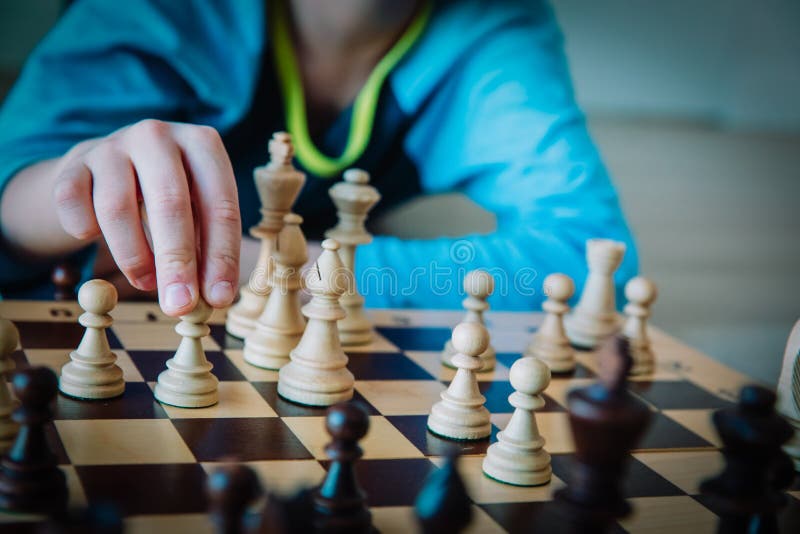 Boy Learning To Play Chess, Kid Making Move in Game Stock Photo - Image ...
