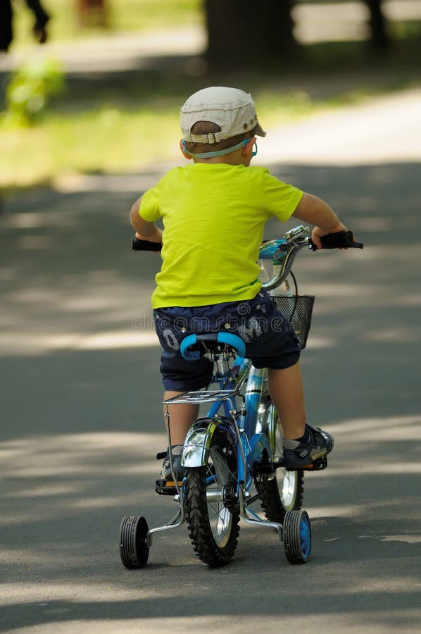Boy learning to ride bike stock image. Image of male - 40085311