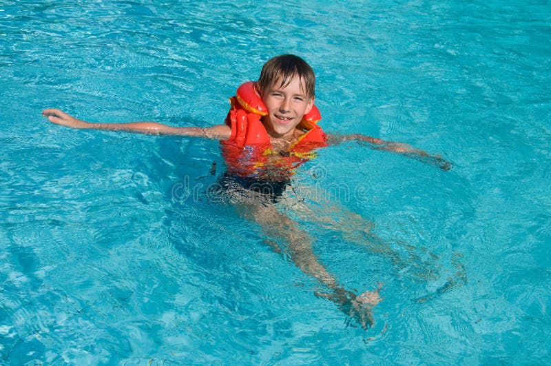 Boy learning to swim stock image. Image of playful, little - 20520487