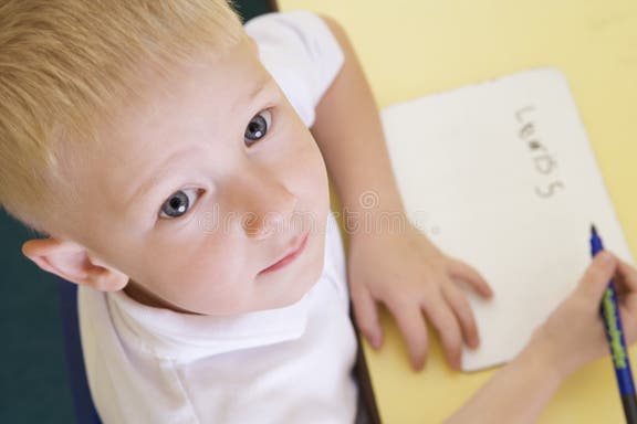 Boy Learning To Write Name in Primary Class Stock Photo - Image of name ...