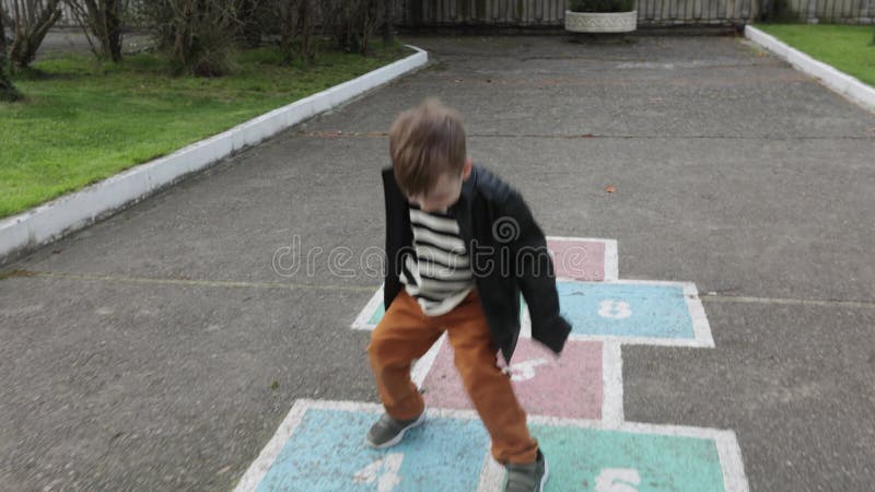 The Boy Learns To Jump on the Hopscotch Drawn Stock Video - Video of ...