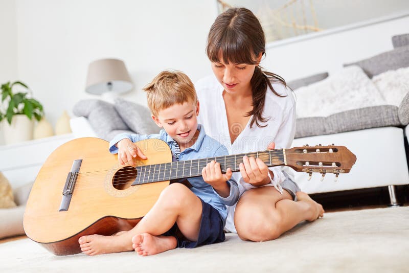 Boy Learns To Play Guitar at Home Stock Image - Image of instrument ...