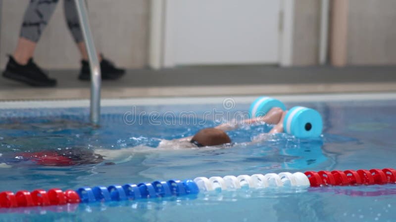 Boy Learns To Swim on His Back Stock Footage - Video of swimming ...