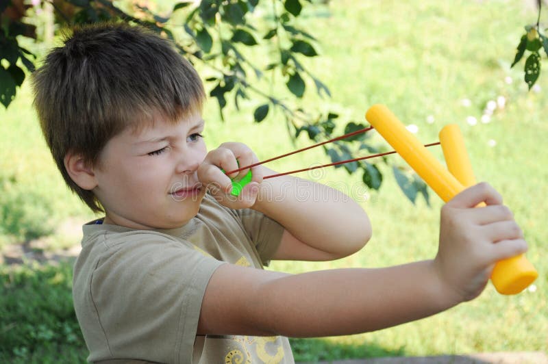 A Boy with a Left-handed Catapult Stock Photo - Image of little ...