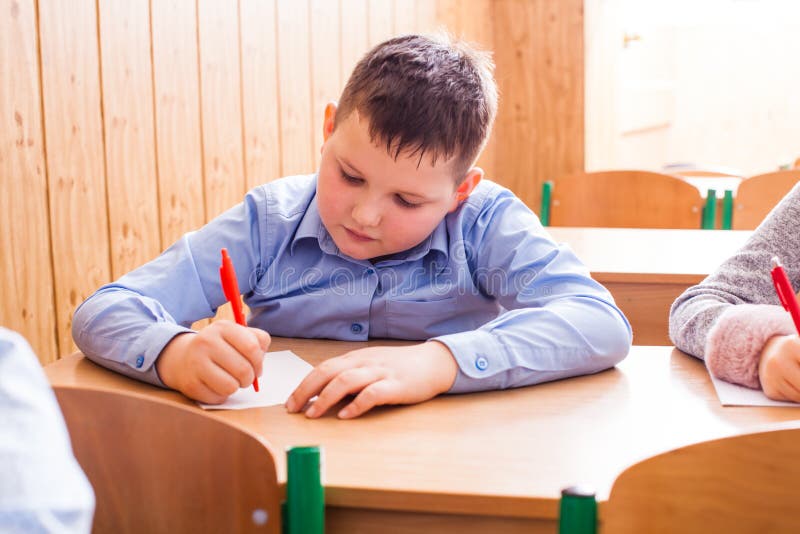 Boy at the lesson stock photo. Image of exercise, indoors - 111930160