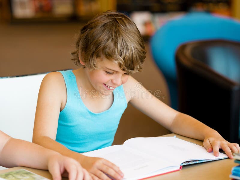 Boy in library stock photo. Image of learn, project - 100192412