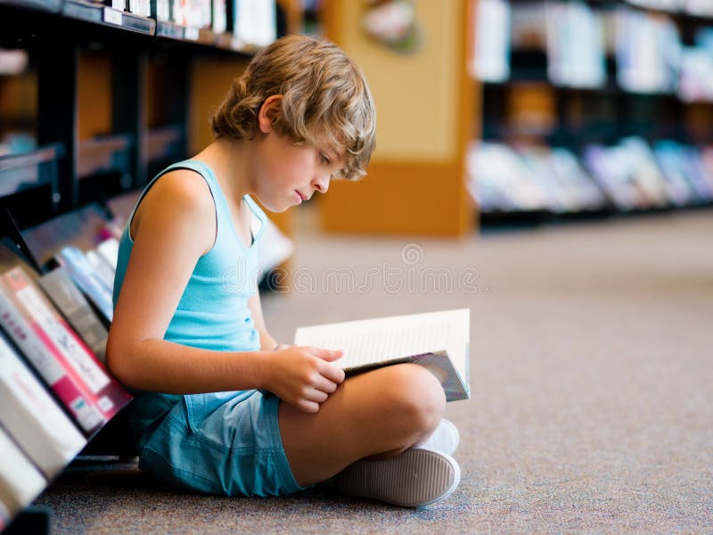 Boy in library stock photo. Image of child, read, portrait - 53254478