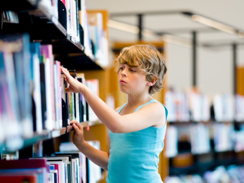Boy in library stock photo. Image of learn, portrait - 53013362