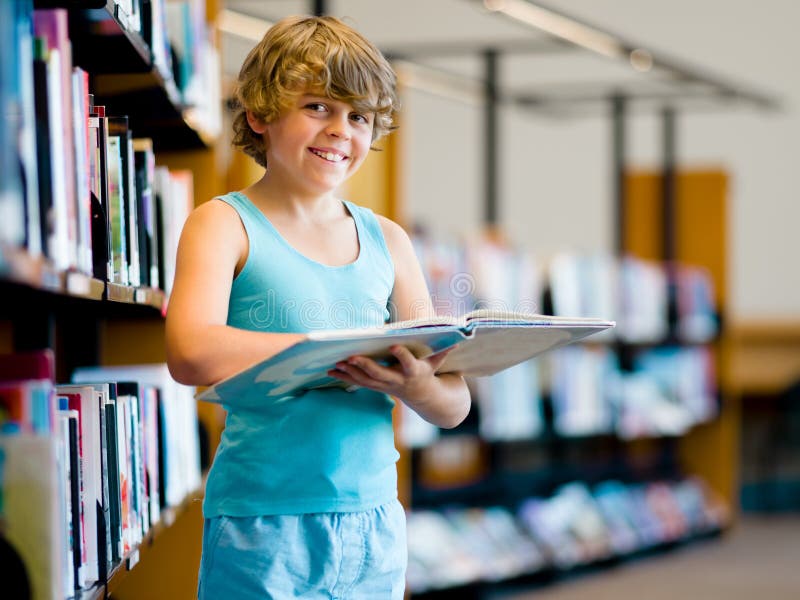 Boy in library stock photo. Image of elementary, knowledge - 53254714