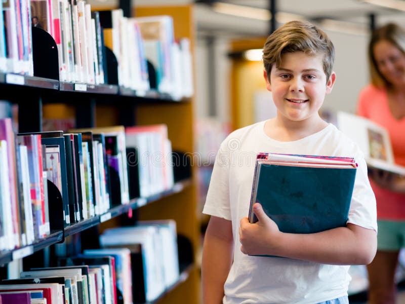 Boy in library stock image. Image of bookshelf, project - 56147439